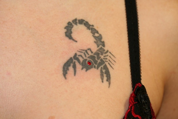 29 Tattoo Design Ideas With Dermal Piercings To Add Glam To Your Ink Yourtango